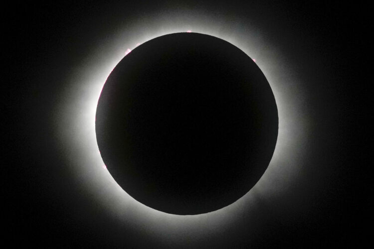 A total solar eclipse raced across North America as clouds parted along ...